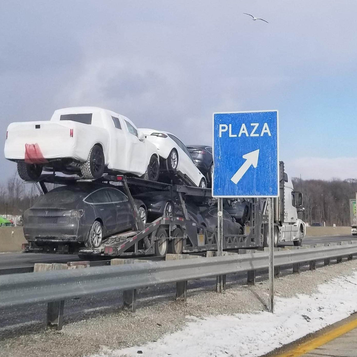 Tesla car carrier spotted with a truck on board. Could it be the Tesla ...